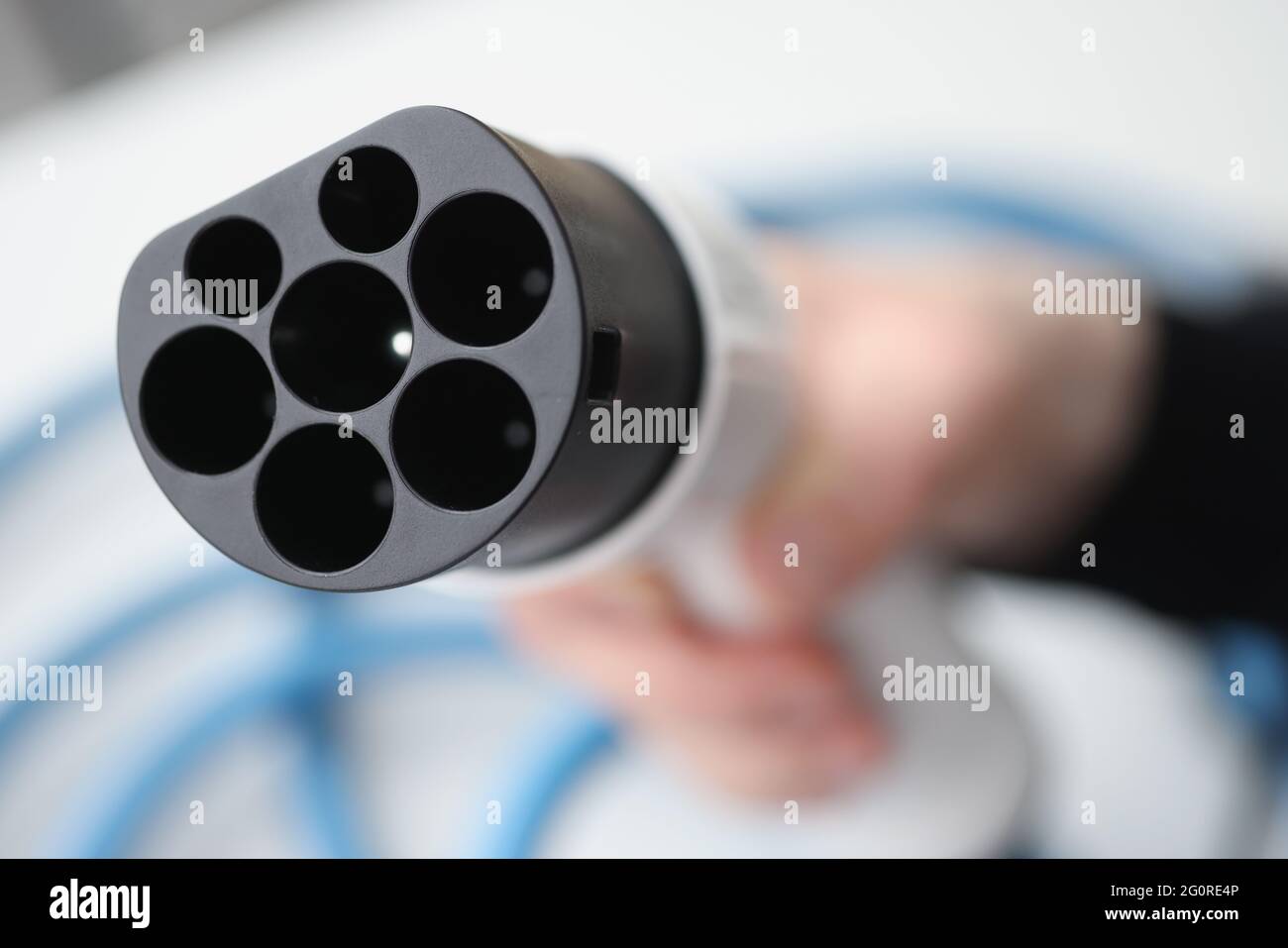 Plug for charging electric vehicle and hybrids Stock Photo - Alamy