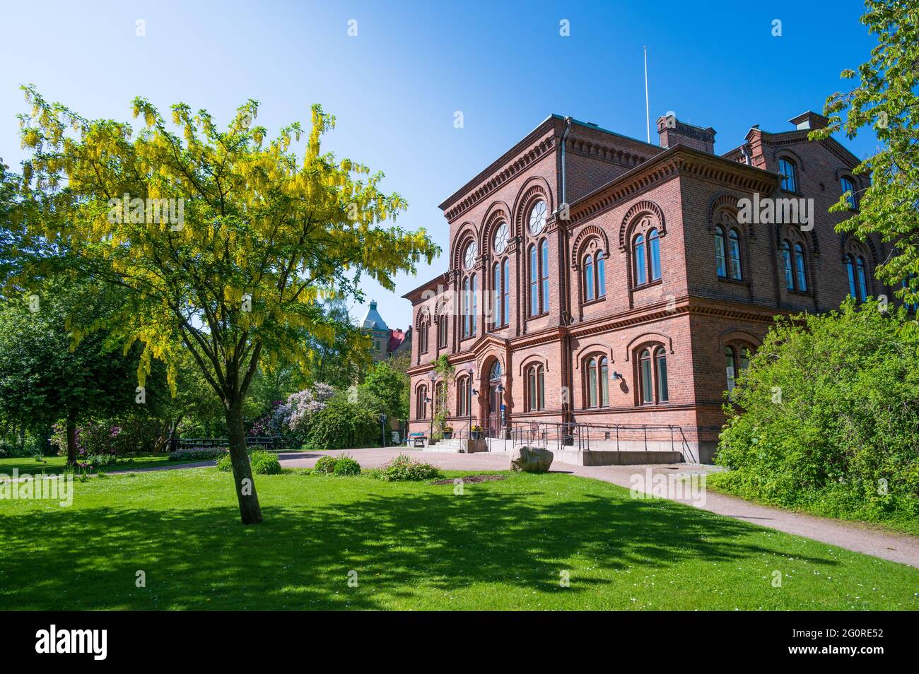 One of the historic university buildings in a beautiful garden in Lund ...