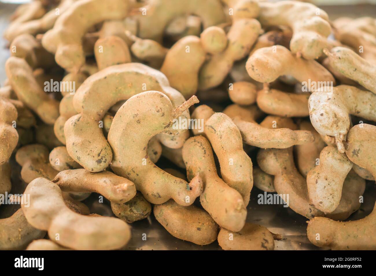 A pile of fresh organic tamarind in the market Stock Photo - Alamy