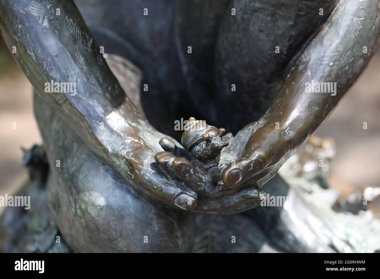 Arts & Culture Concept - Abstract detail of child's hands on the Bronze ...