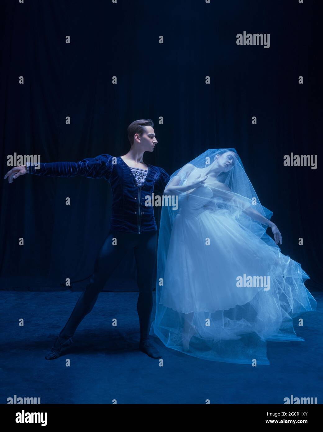 Art performance. Two graceful ballet dancers, man and woman dancing ...