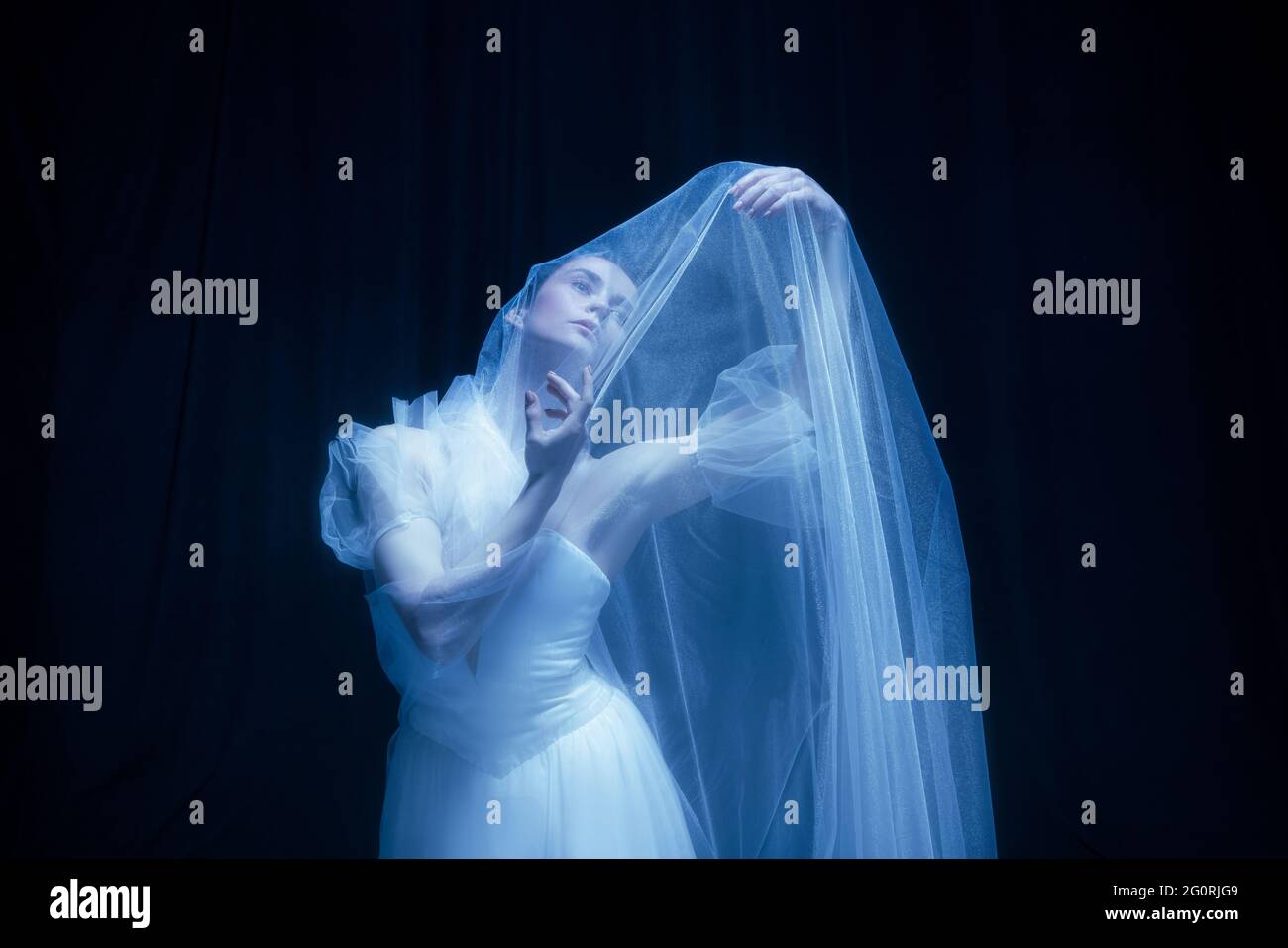 Loneliness. Young graceful beautiful woman, balerina in white wedding ...