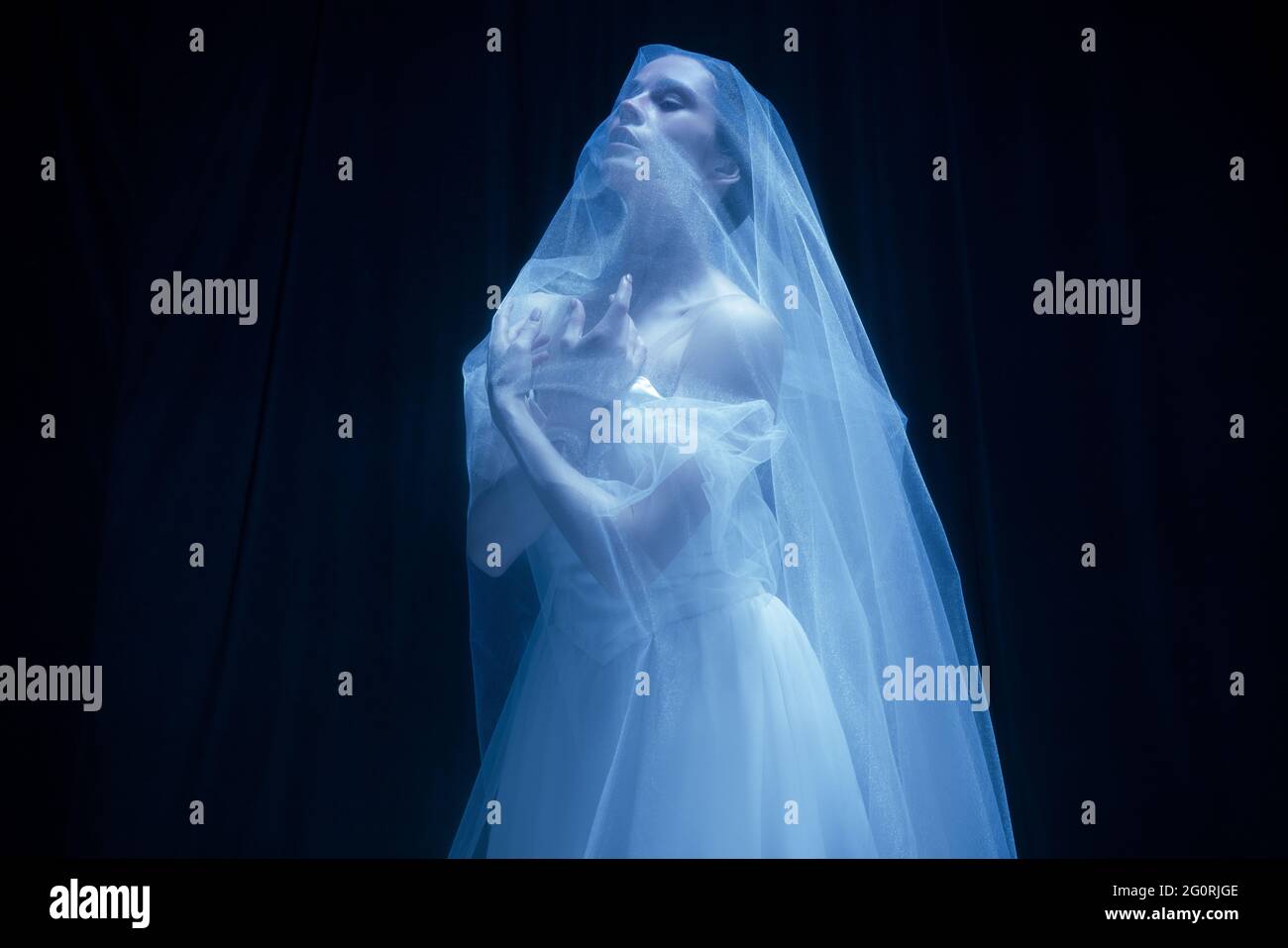 Loneliness. Young graceful beautiful woman, balerina in white wedding ...