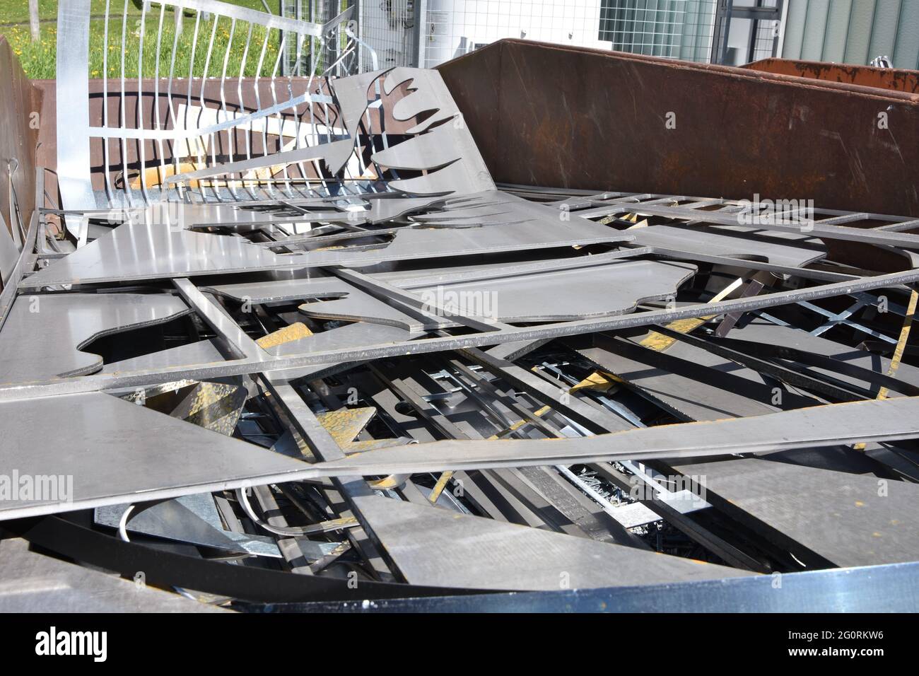 Metal plates as waste collected in a container in a community disposal ...