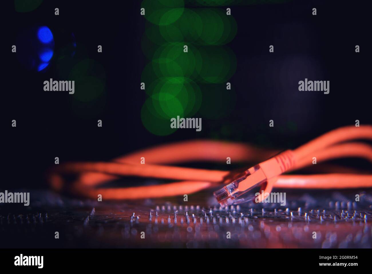 RJ45 twisted pair wire on the background of computer technology in the ...