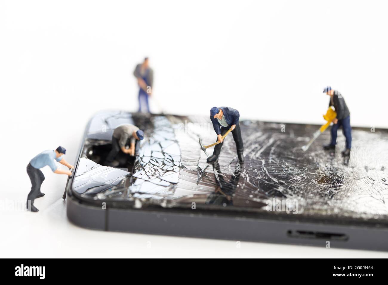 Mini technicians repairing broken screen phones caused by falling ...