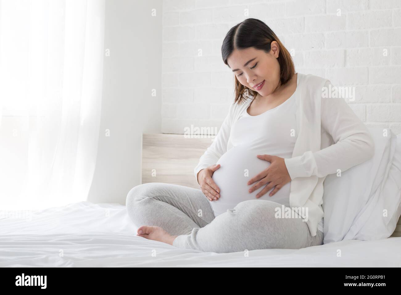 Asian pregnant women happy during pregnancy in the bedroom, Happiness ...