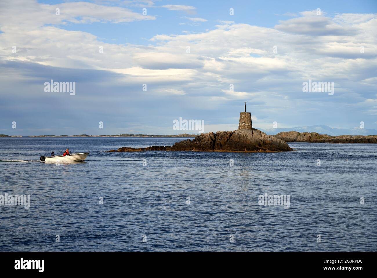 VEVANG, NORWAY - Jul 28, 2020: A family is enjoying a boat trip between ...