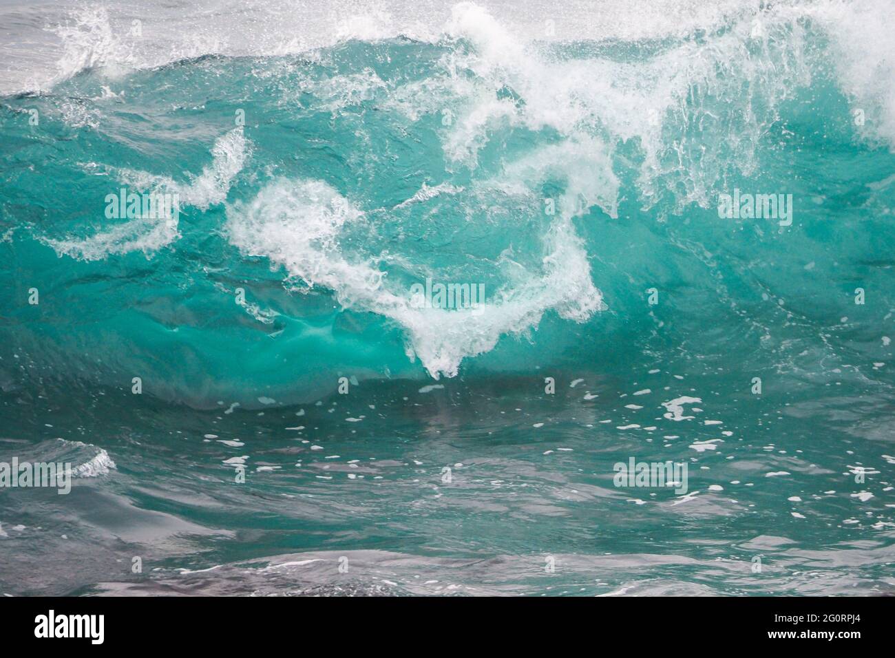 sunlight shining through Glorious Azure blue ocean wave breaking ...