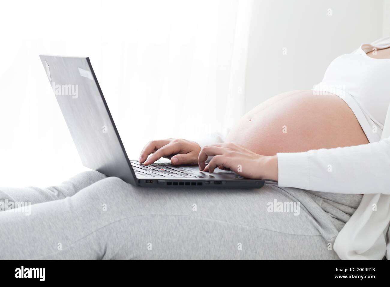 Pregnant women use internet by laptop for seeking pregnancy related ...