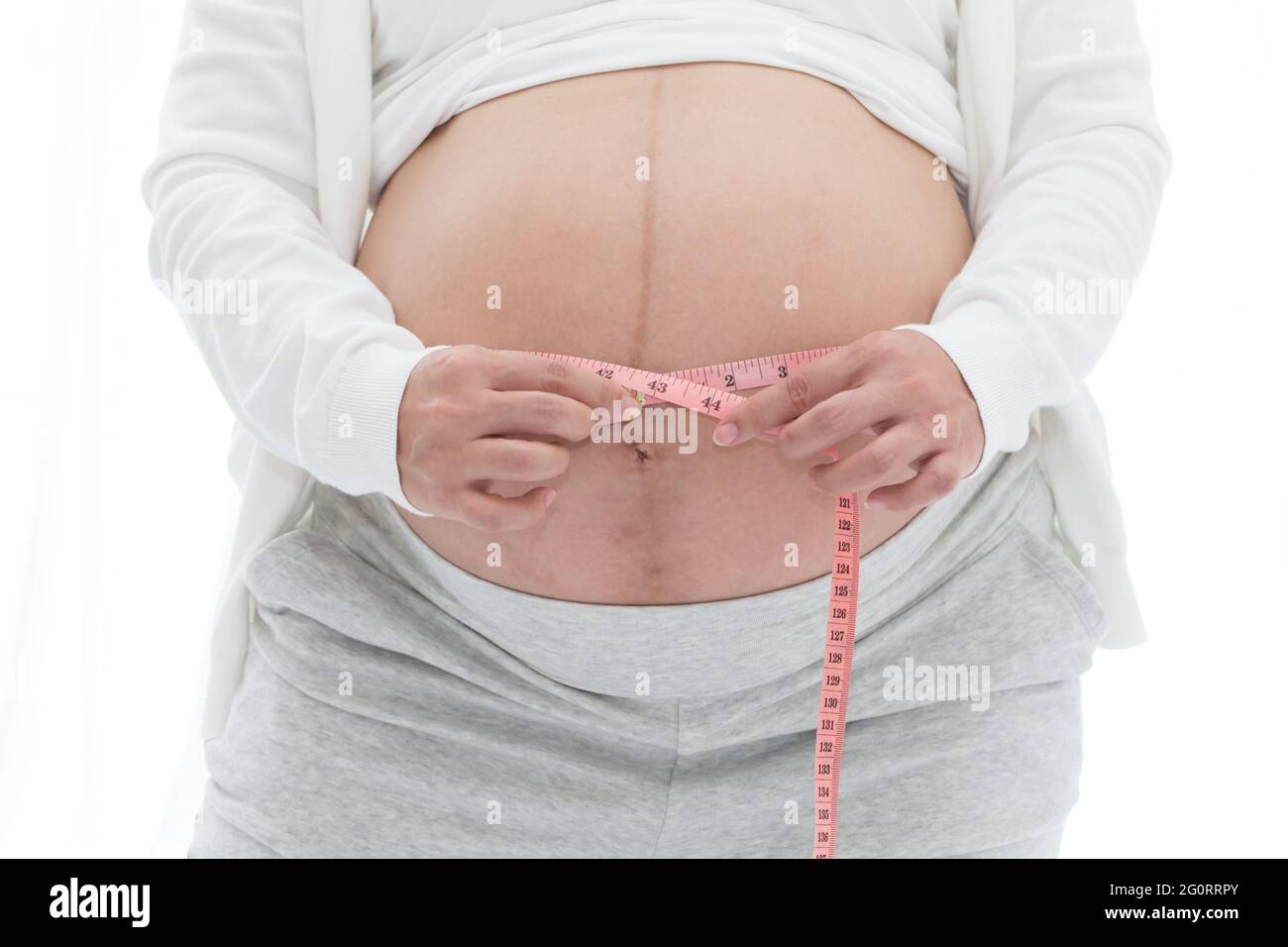Size of pregnancy belly Stock Photo - Alamy