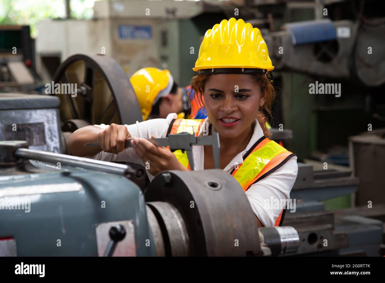 Heavy industrial worker is working on metal work factory, Machine for ...
