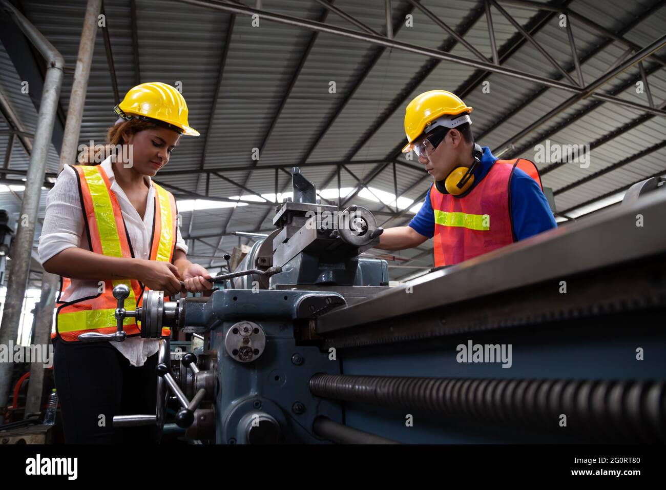 Heavy industrial worker is working on metal work factory, Machine for ...