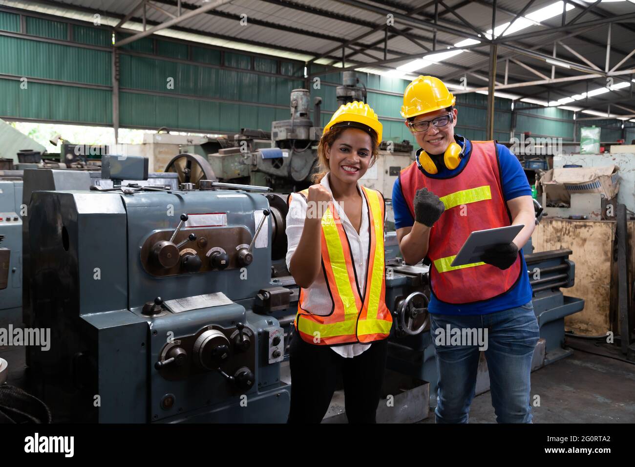Portrait of manual woman and man worker is standing with confident and ...