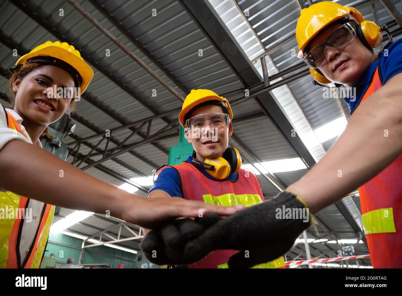 Technical specialist engineer putting their hands together. Stack of ...