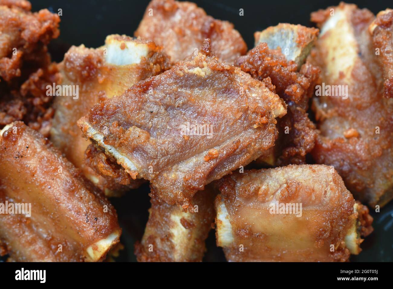 fried crispy pork bone or rib on plate dipping chili sauce cup Stock ...