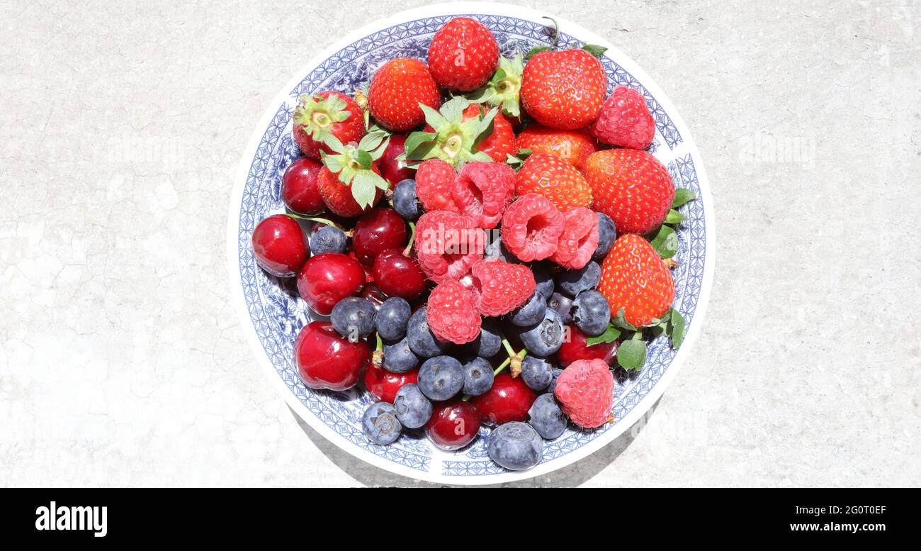 Fresh fruits and berries on daylight Stock Photo - Alamy