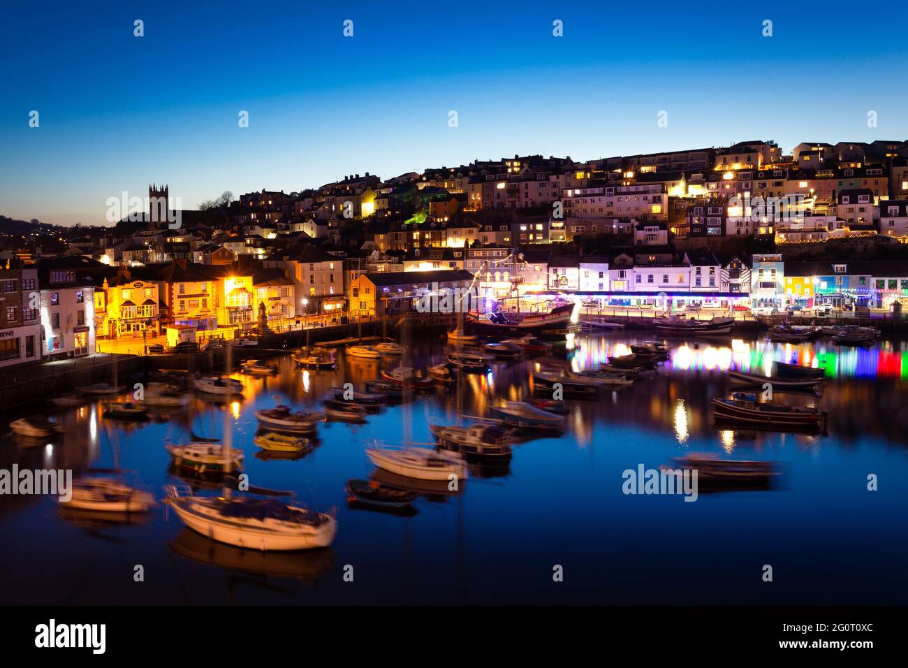 View of boats around the harbour side at dusk at the fishing port of ...
