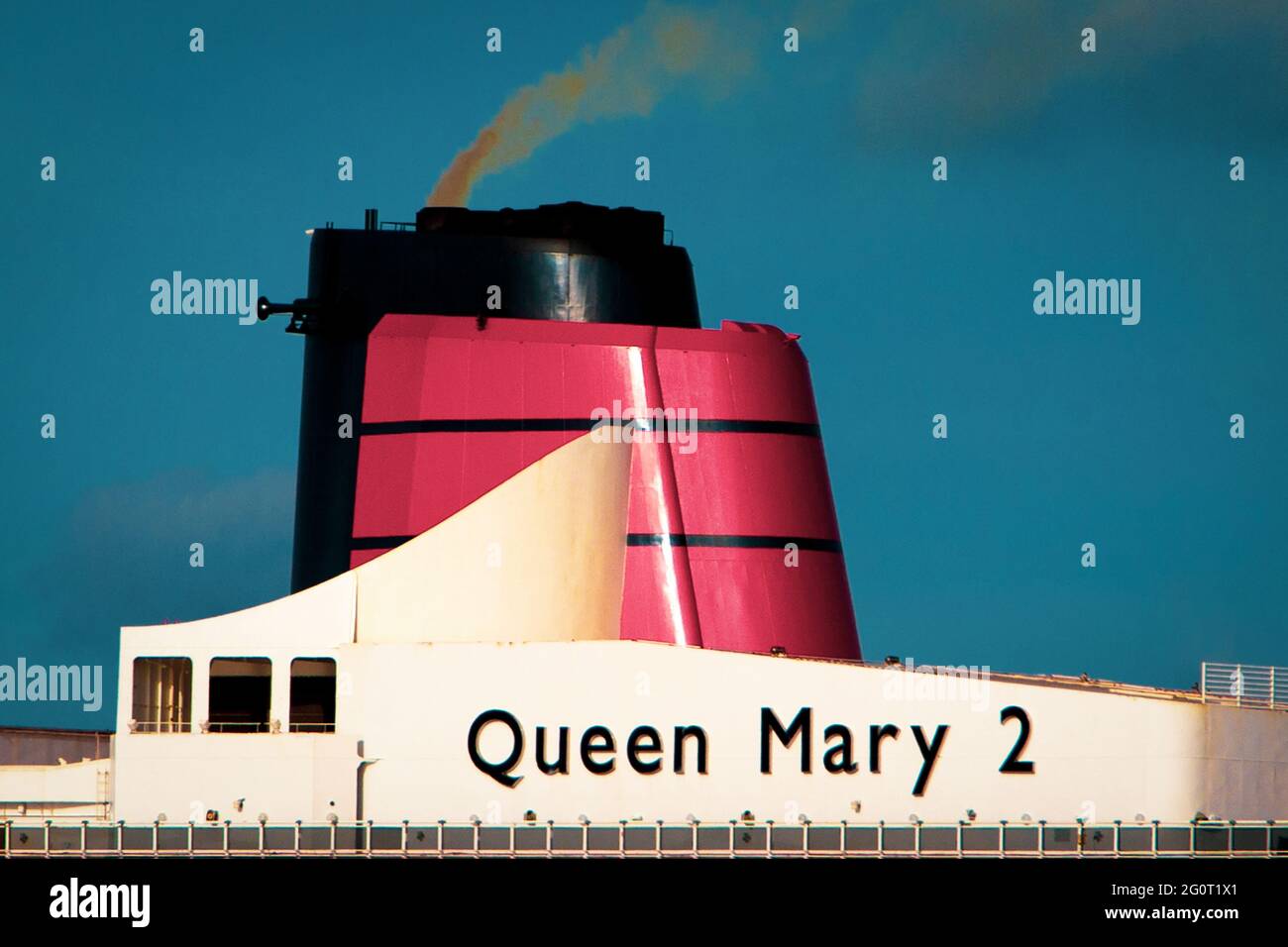 The Queen Mary 2 cruise ship funnel shines brightly in the sunshine ...