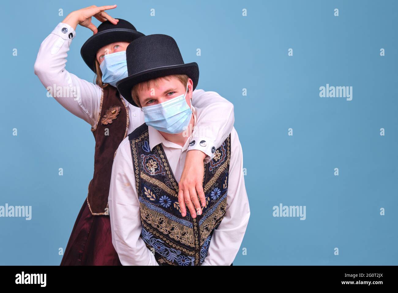 Actors on a blue background wearing medical masks on their faces Stock ...