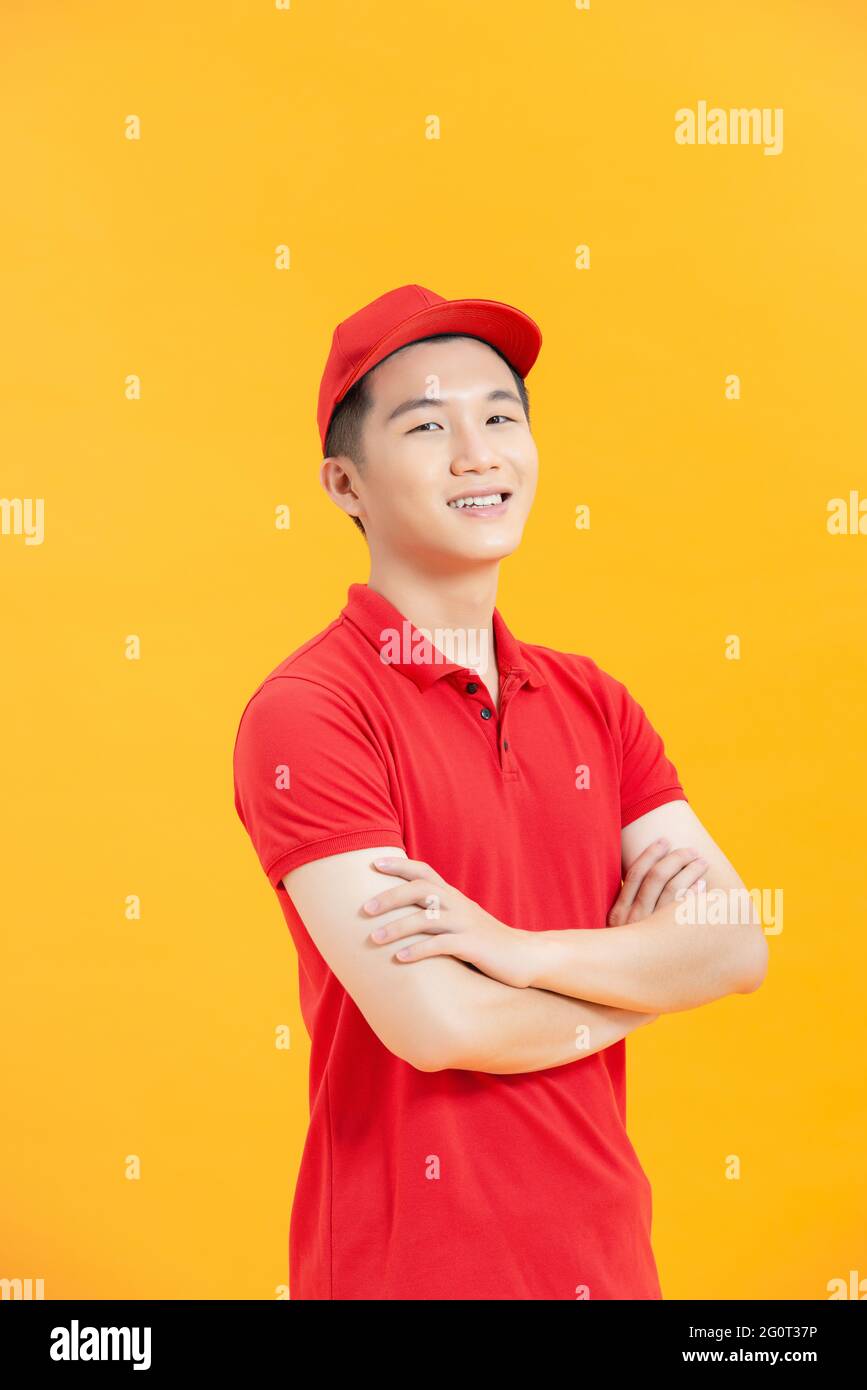 Delivery Man Standing Hands Crossed Smiling Stock Photo - Alamy