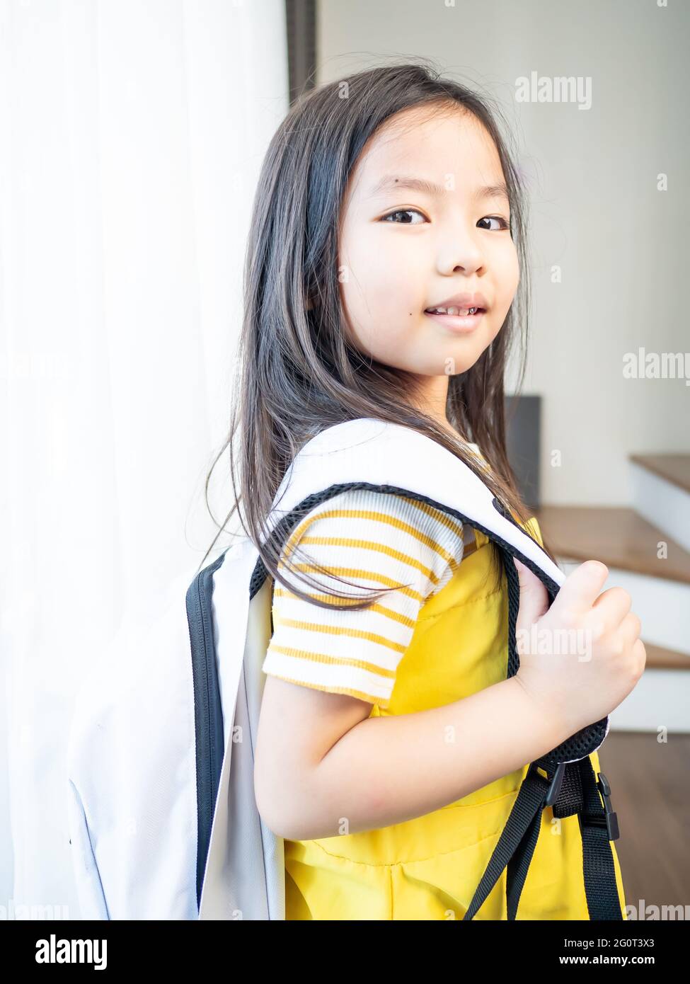 Happy Asian children carry backpacks. back to school concept Stock ...