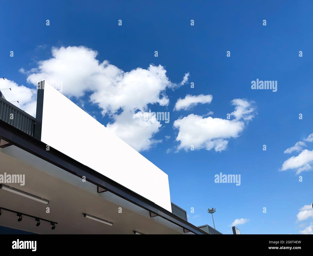 White blank sign board on clear blue sky for advertisement copy space ...