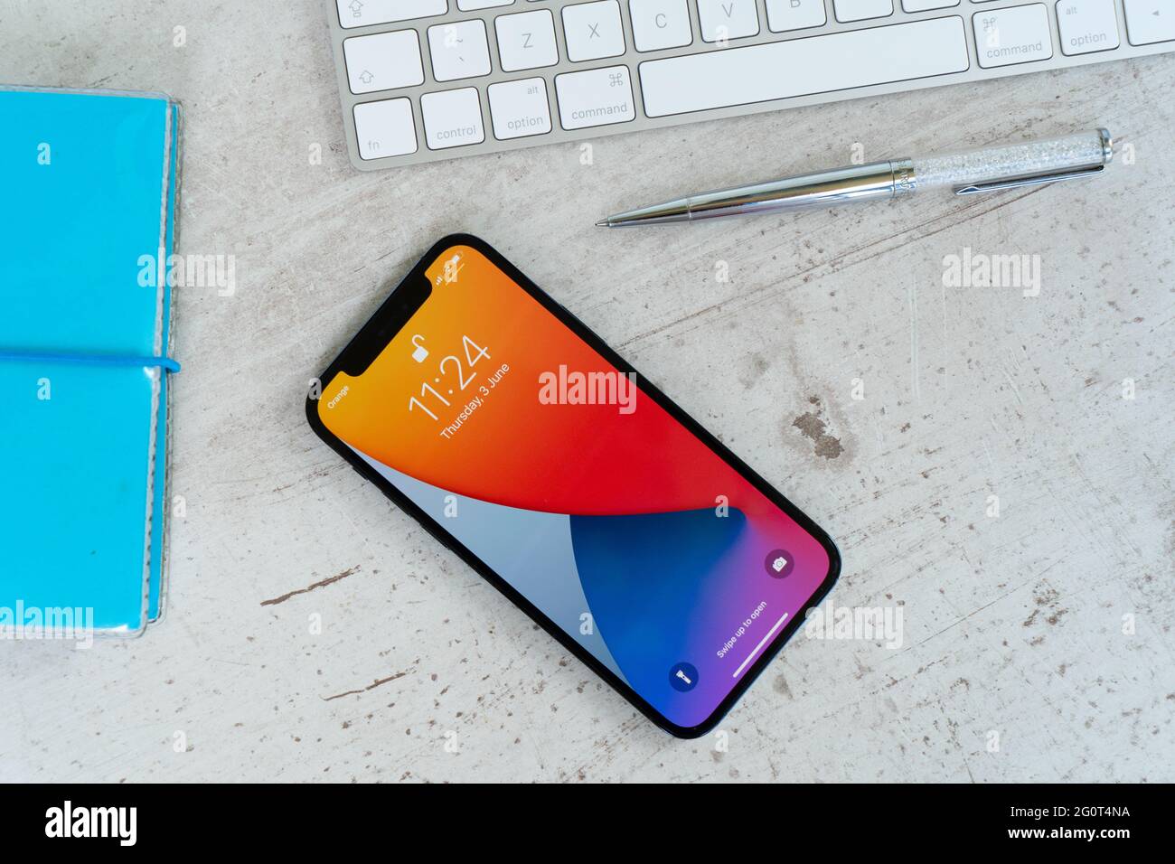 Iphone 12 pro on white desk Stock Photo - Alamy