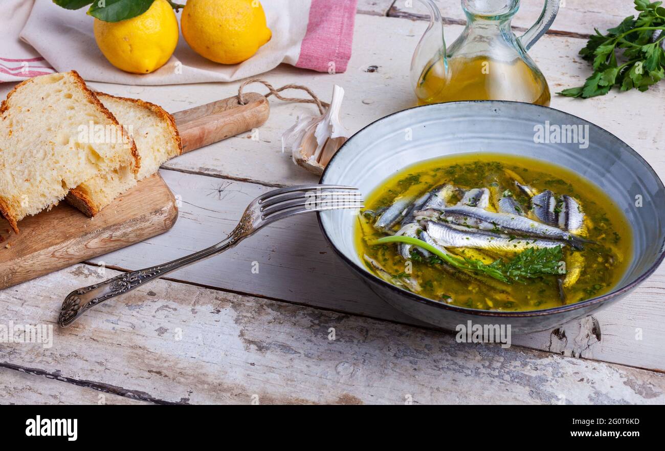 Marinated anchovies in lemon juice with olive oil garlic and parsley ...