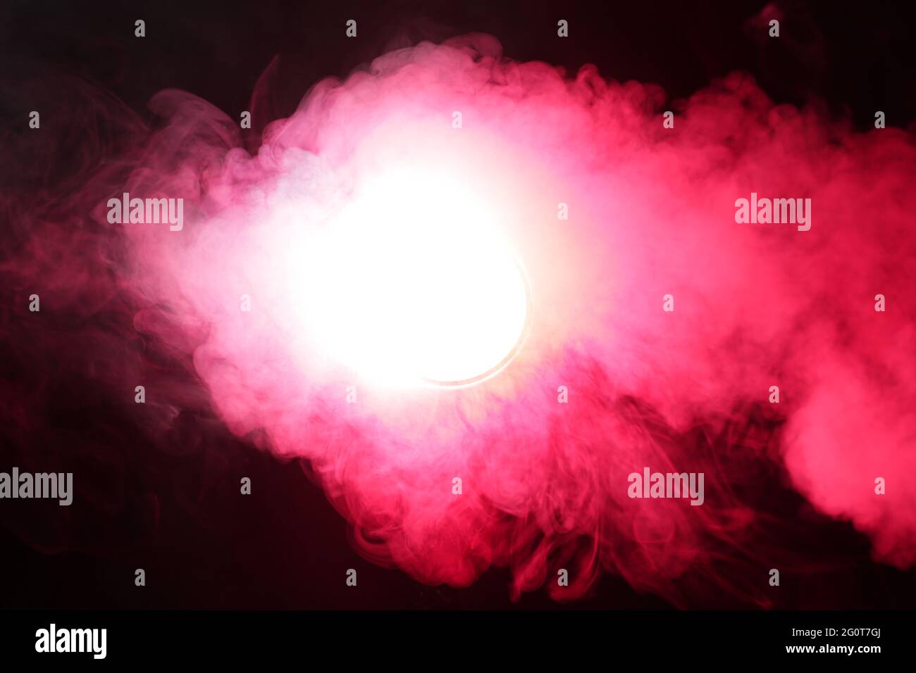 Smoke in red light on black background Stock Photo - Alamy