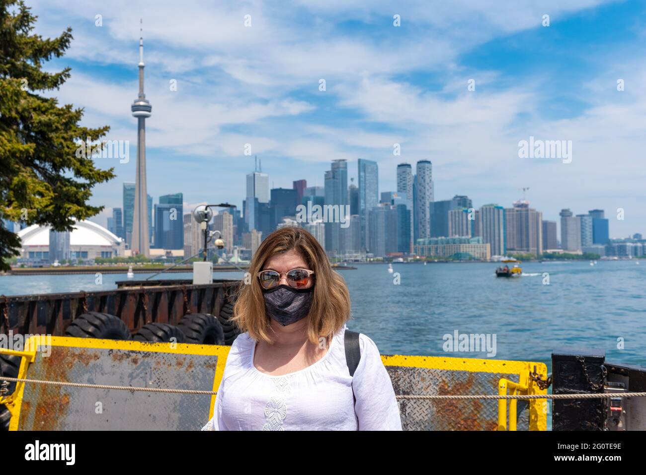 Portrait of a Latin American middle age woman as the ferry arrives at ...