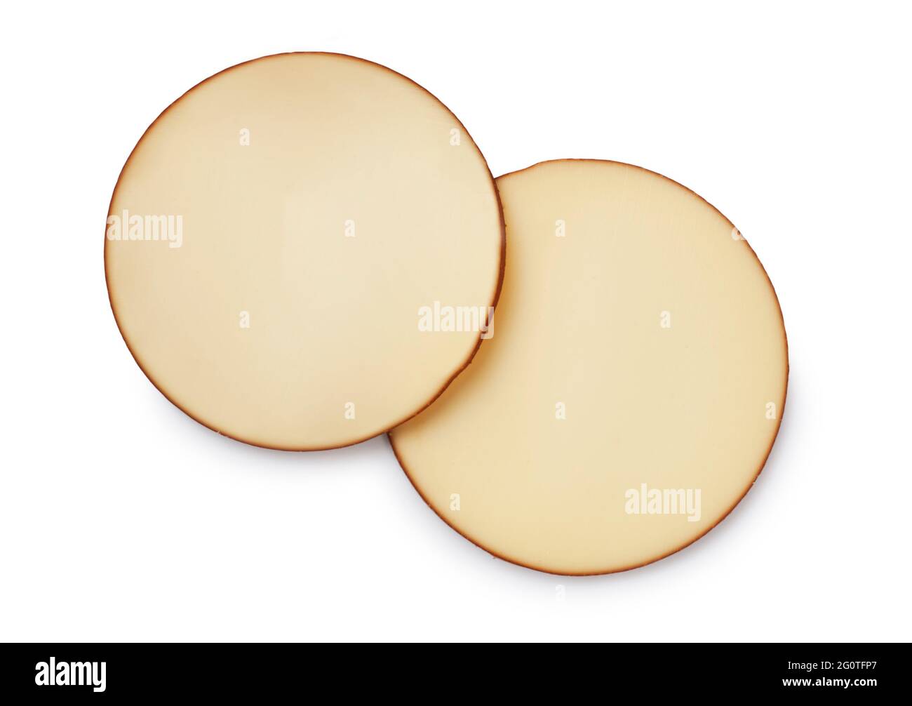 Studio shot of circular slices of smoked cheese cut out against a white ...