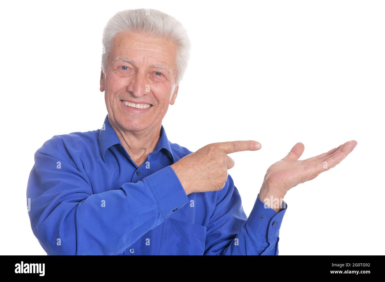 Senior handsome man showing something hi-res stock photography and ...