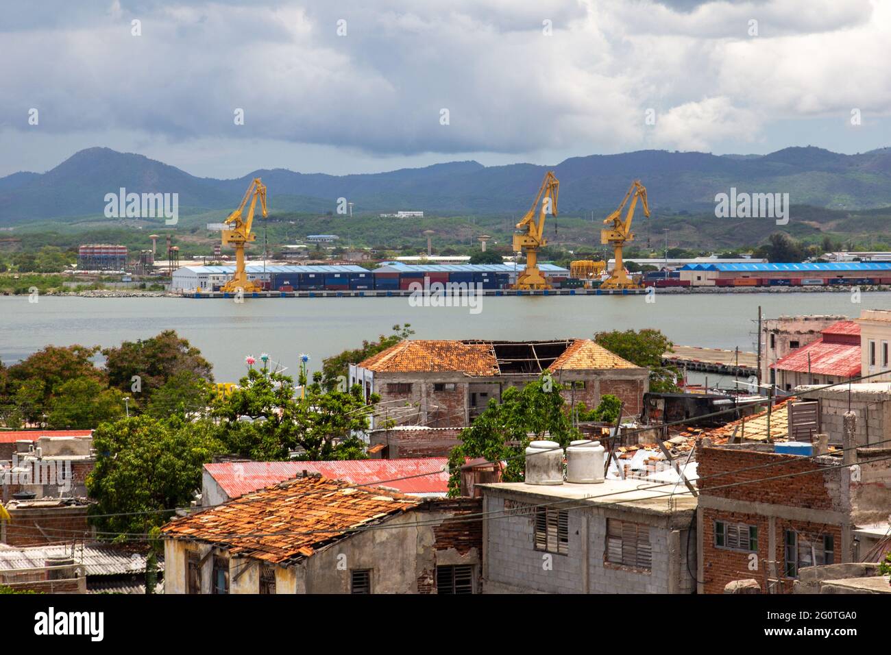 Weathered and run down houses by the Santiago de Cuba port, Cuba ...