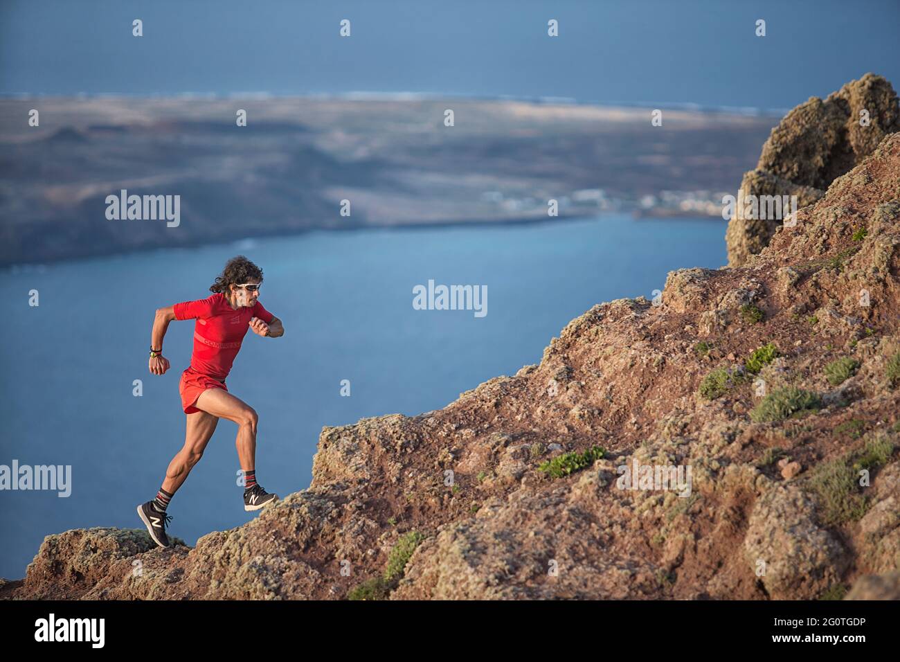 Trail runner running at the Mirador del Rio (Lanzarote Stock Photo - Alamy