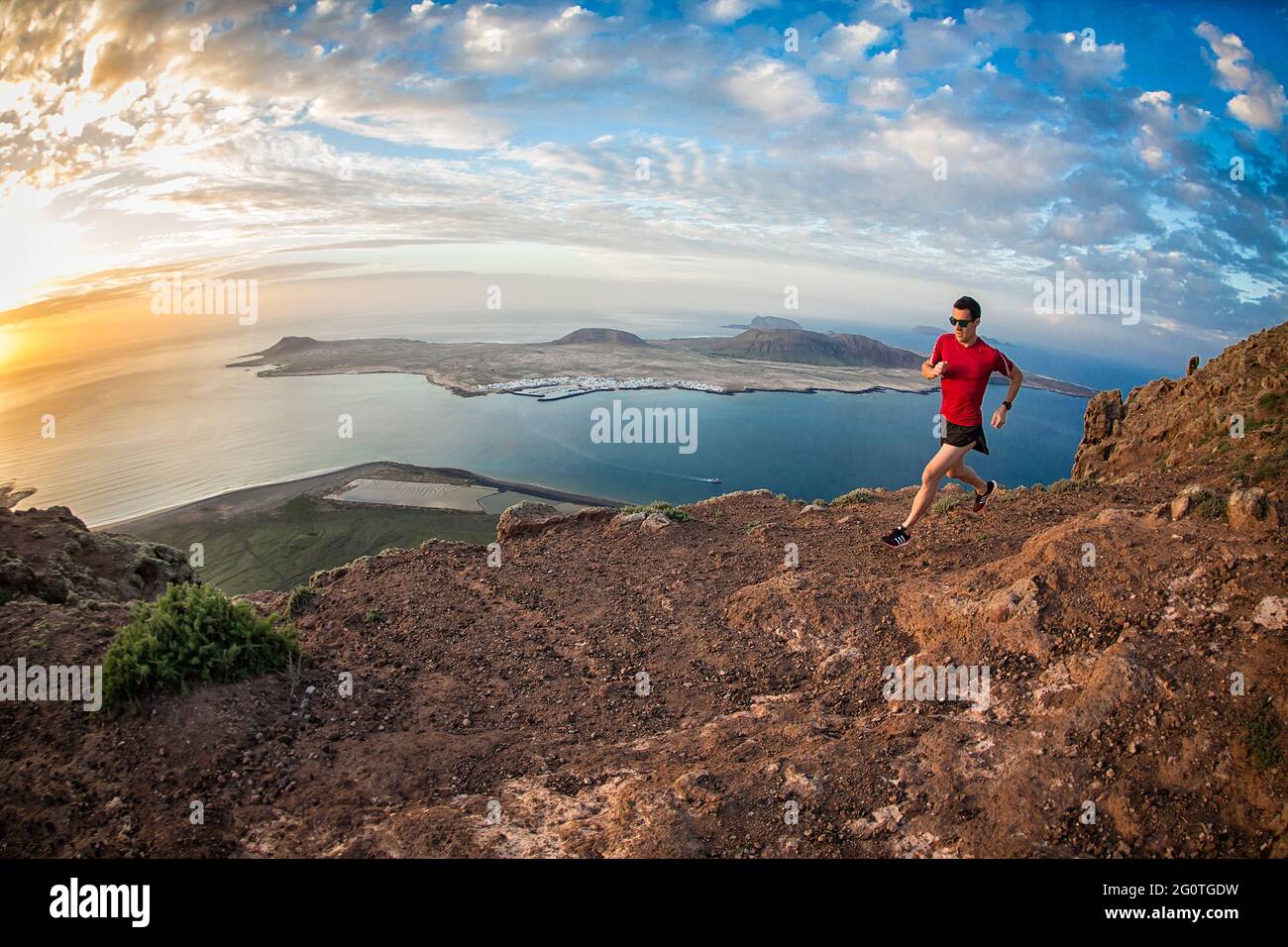 Trail runner running at the Mirador del Rio (Lanzarote Stock Photo - Alamy