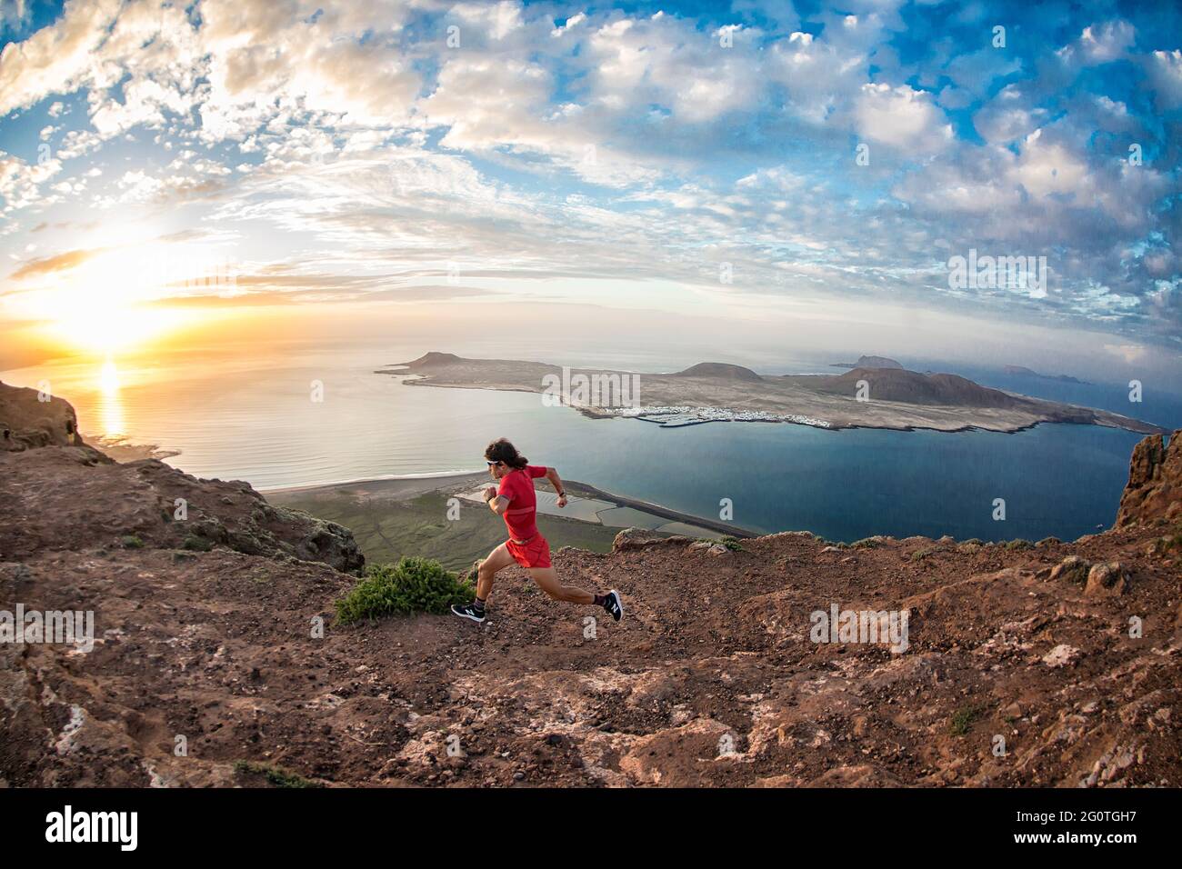 Trail runner running at the Mirador del Rio (Lanzarote Stock Photo - Alamy