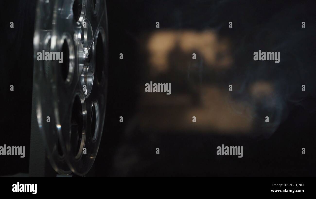 Old projector filming on the black background Stock Photo - Alamy