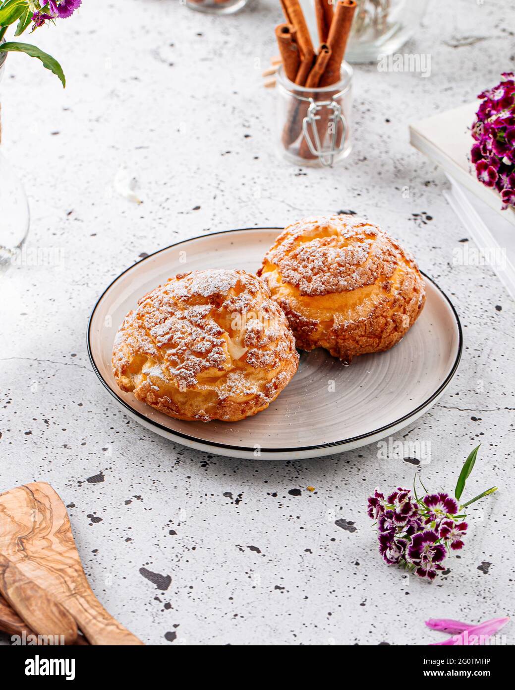 Fresh baked choux pastry cakes with sugar Stock Photo - Alamy