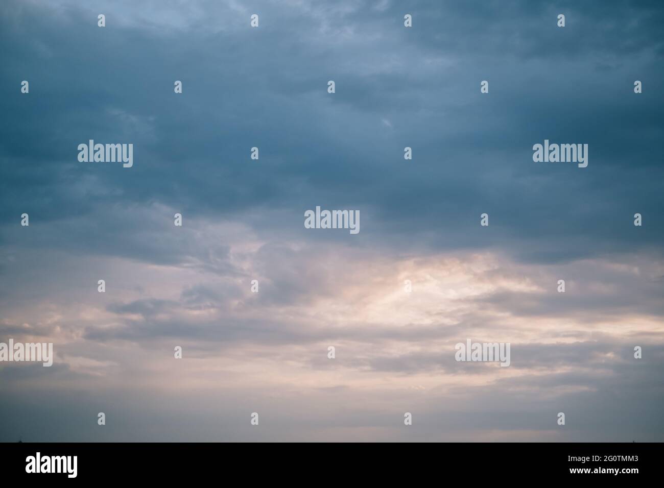 Magic sunset clouds. Atmospheric sky of deep blue color Stock Photo - Alamy