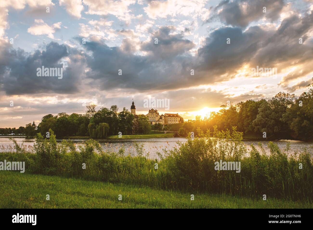 Medieval castle at sunset. Travel in Belarus, Nesvizh Stock Photo - Alamy