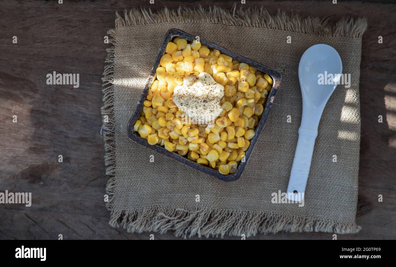 Fried sweet corn with a knob of butter and seasonings Sprinkle with ...