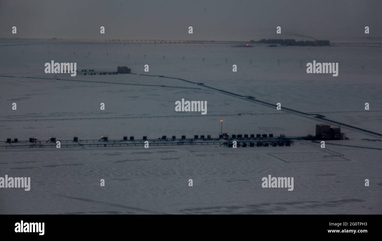 Oil pipeline and iceroad leading from the ConocoPhillips oilwells in ...