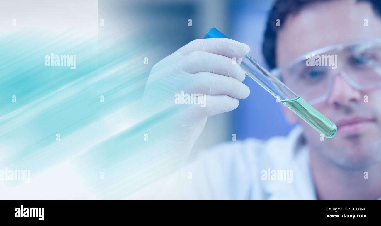 Composition of male scientist holding test tube in laboratory with copy ...