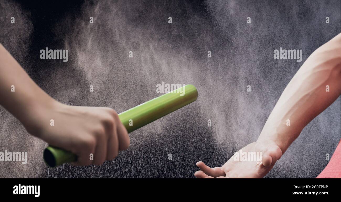 Composition of two caucasian athletes with green relay baton with ...