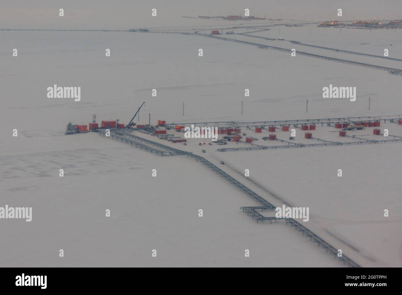 Oil pipeline and iceroad leading from the ConocoPhillips oilwells in ...