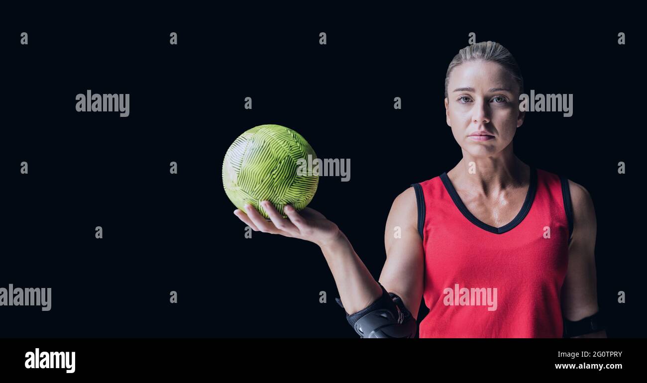Composition of caucasian female handball player holding ball with copy ...