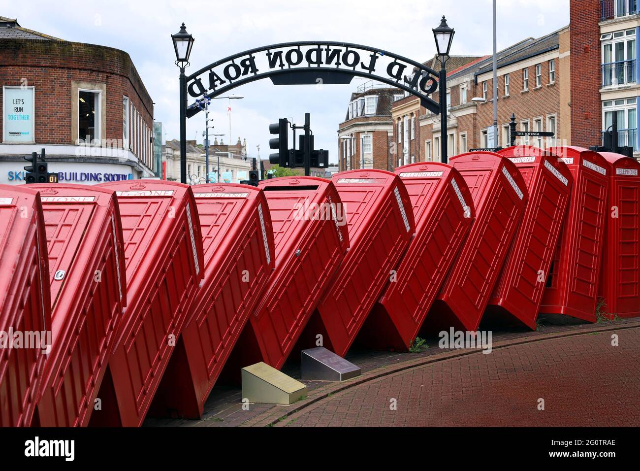 Out of Order by David Mach - a street sculpture of red telephone boxes ...