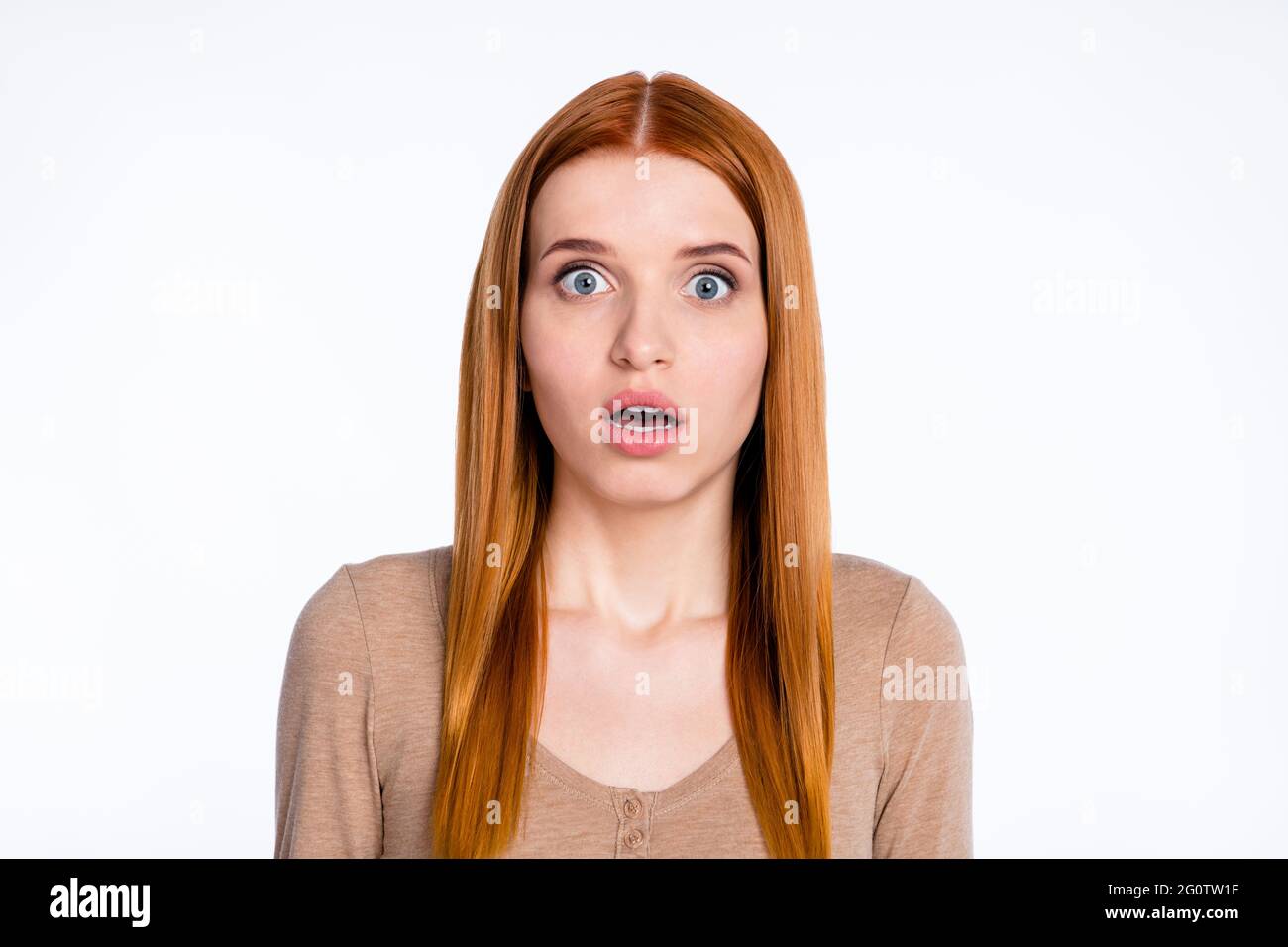 Photo of charming excited redhair woman beige shirt big eyes open mouth ...