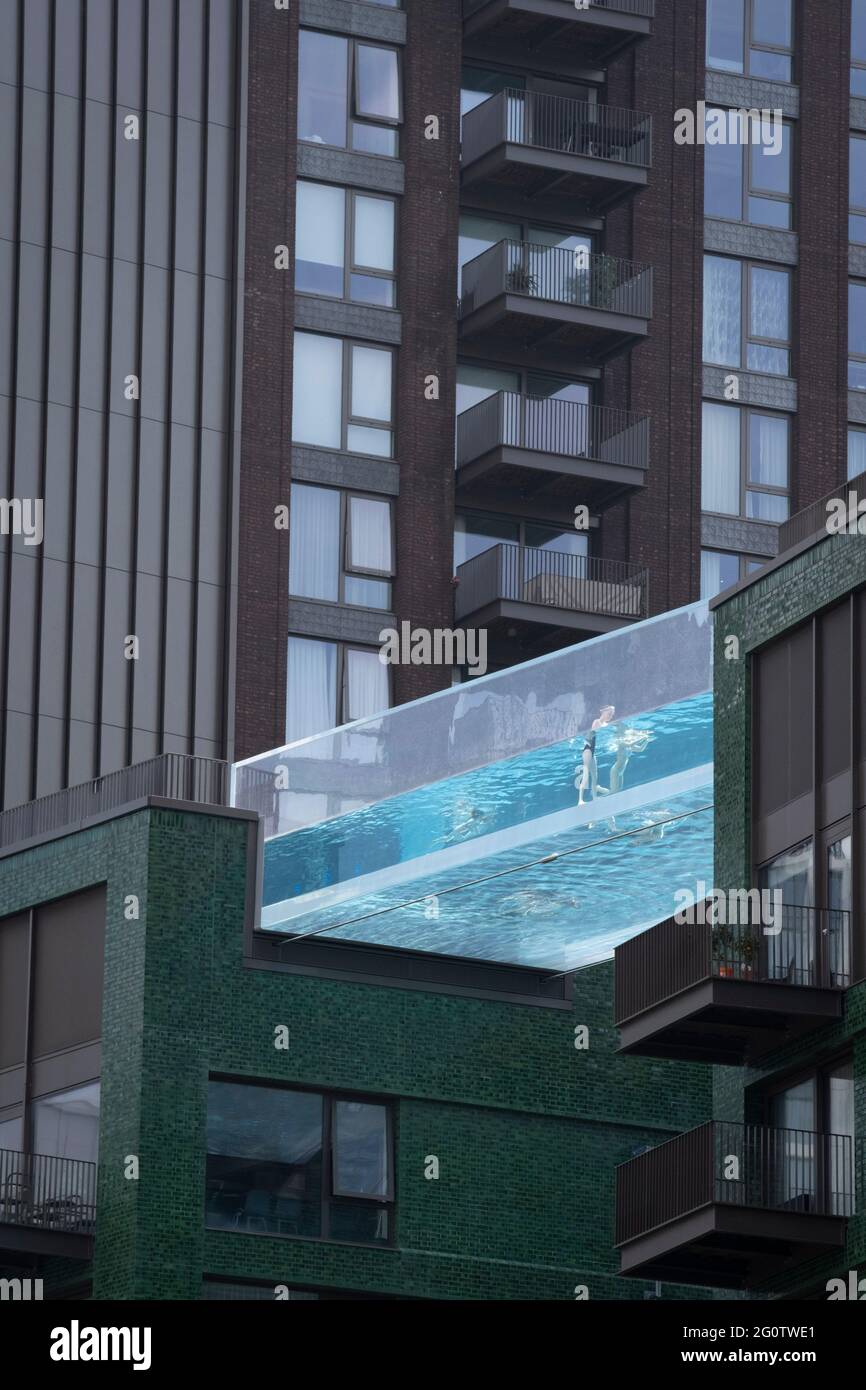 Swimmers enjoy the waters of the Sky Pool, a 25 metres-long transparent ...